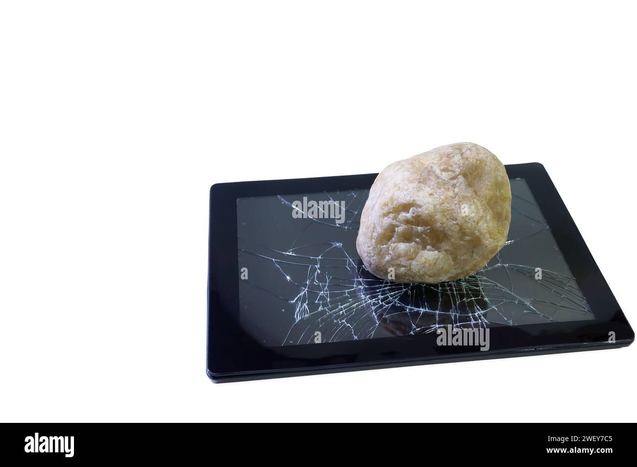 A broken tablet computer as detailed close-up shot on neutral white ...