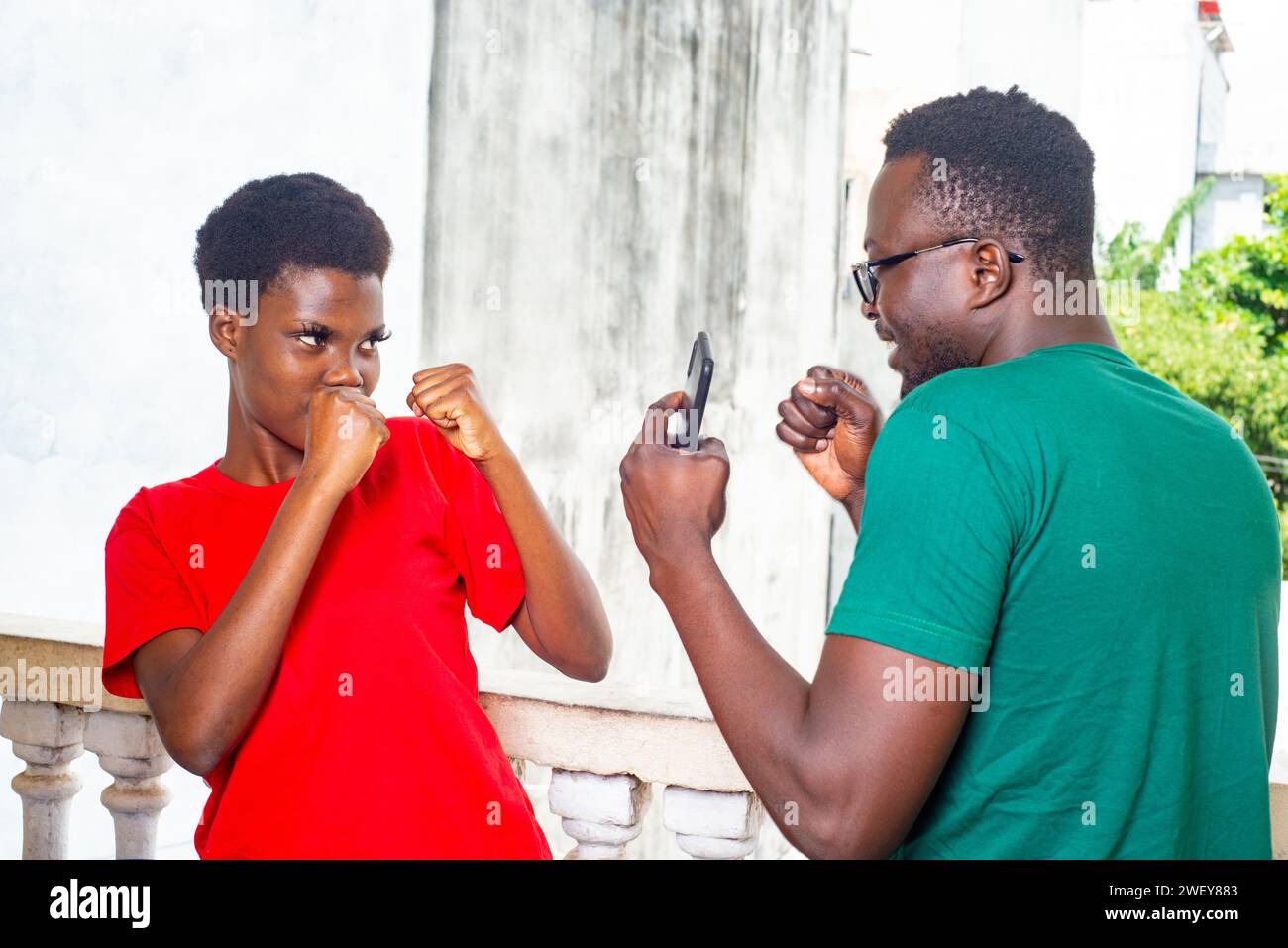 beautiful angry young couple each form their punch for the fight on the ...
