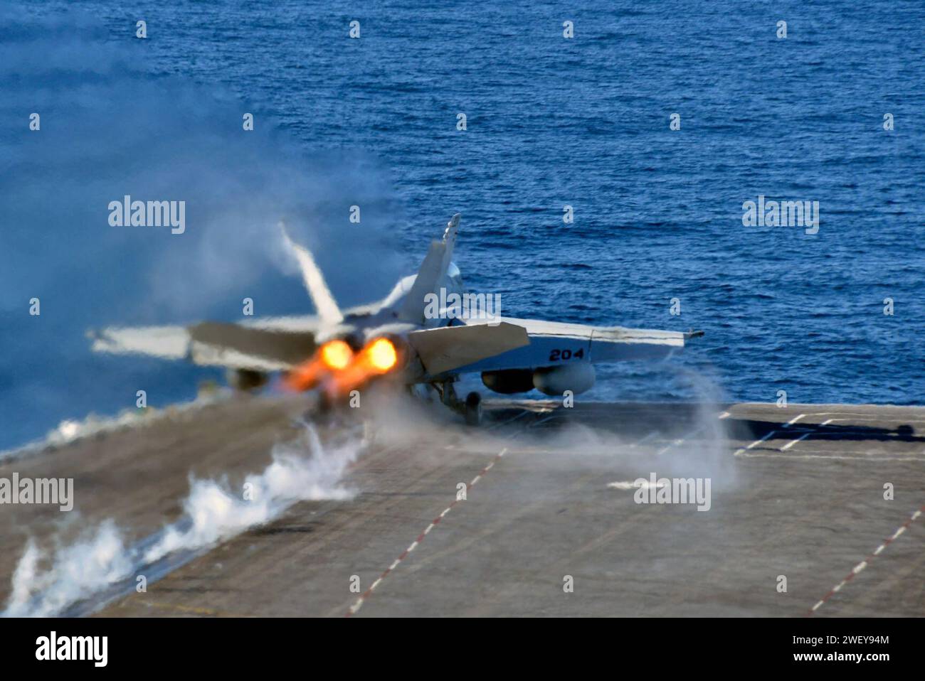 An F-A-18E Super Hornet launches from the aircraft carrier USS Nimitz ...