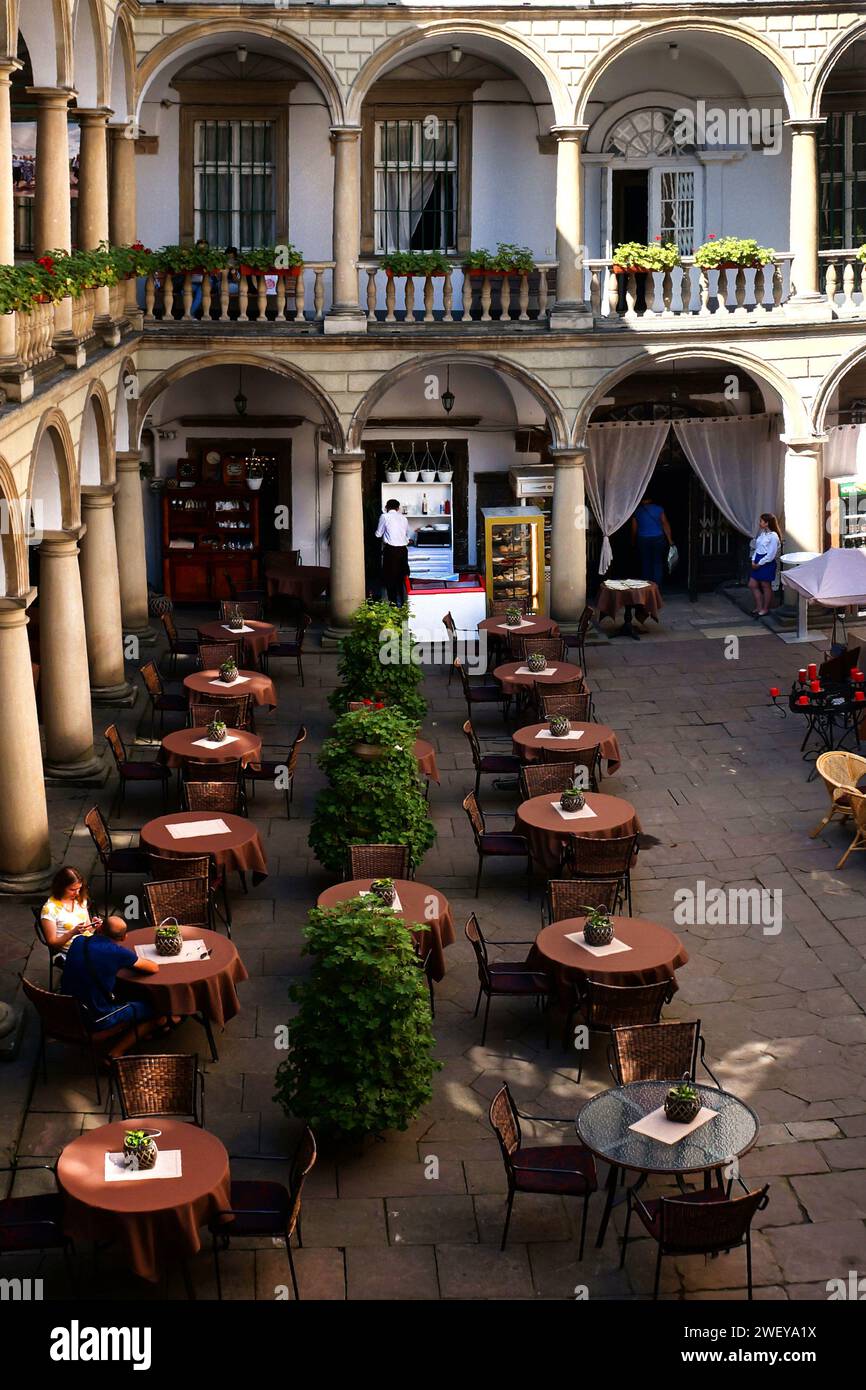 Tables and chairs at outdoor cafe armchair hi-res stock photography and ...