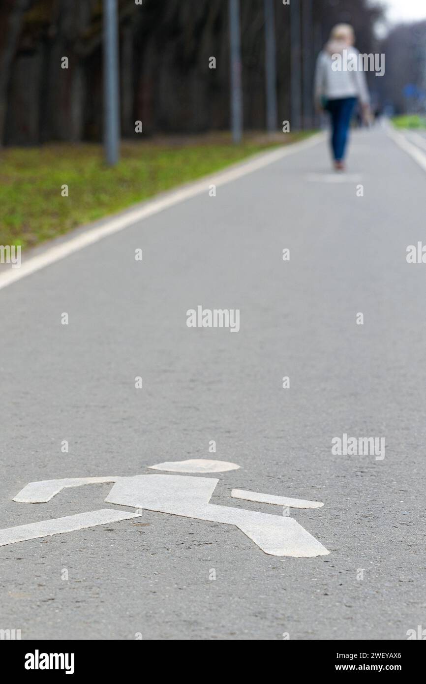 asphalt walking path in a park, vertical shot Stock Photo - Alamy