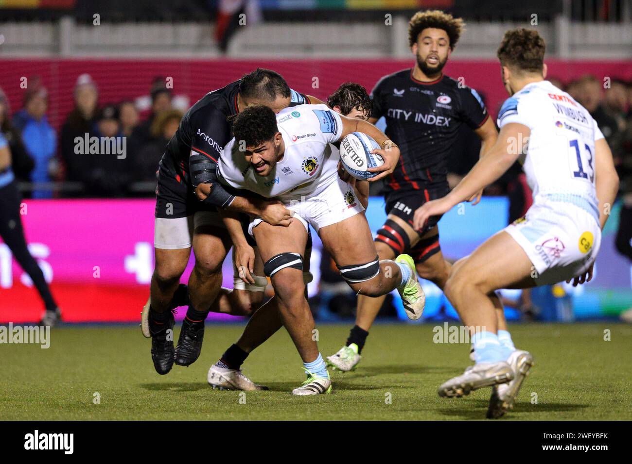 Exeter Chief's Greg Fisilau is tackled by Saracens' Billy Vunipola ...