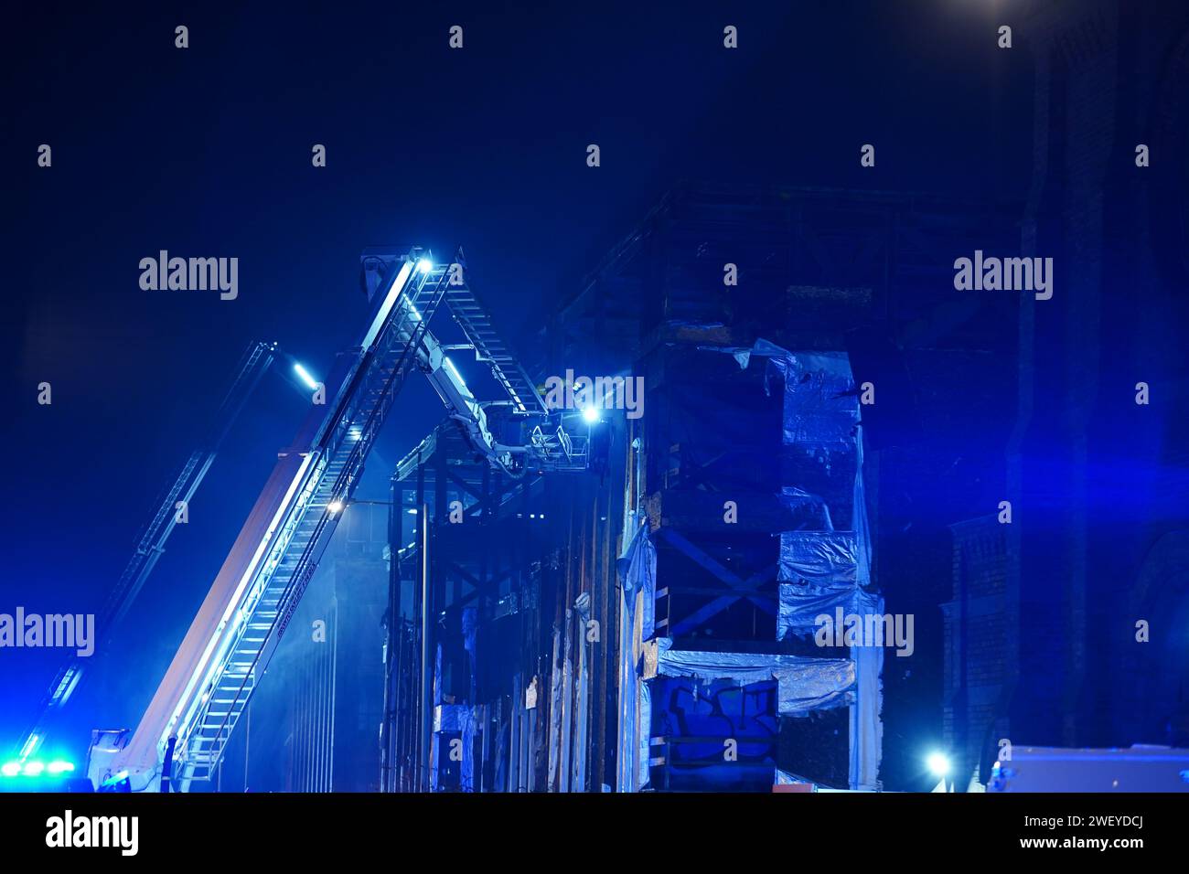 Firefighters at the scene following a fire on Fox Street in Liverpool ...
