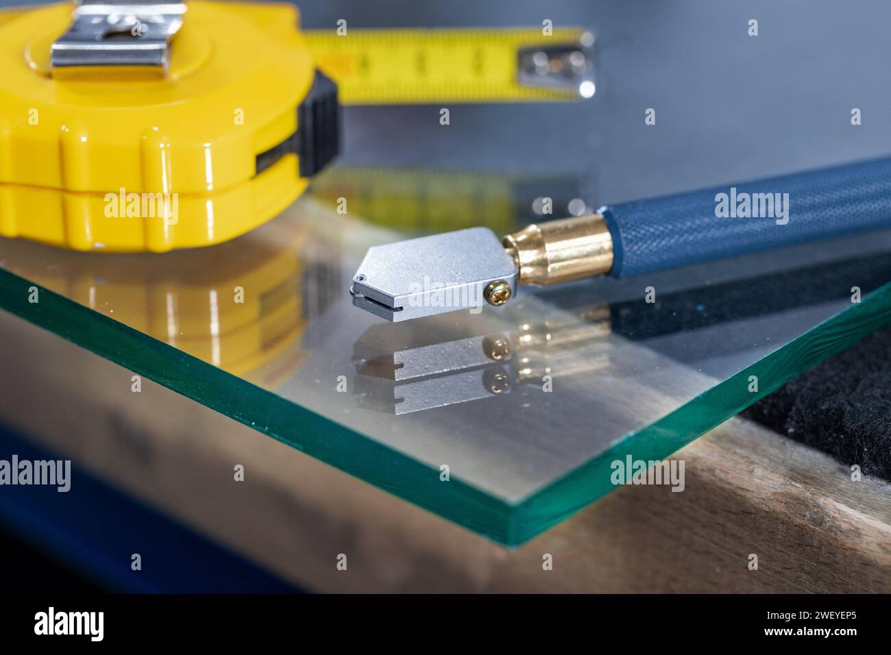 Glass workshop, Thick piece of glass and glass tools, close up, Concept ...