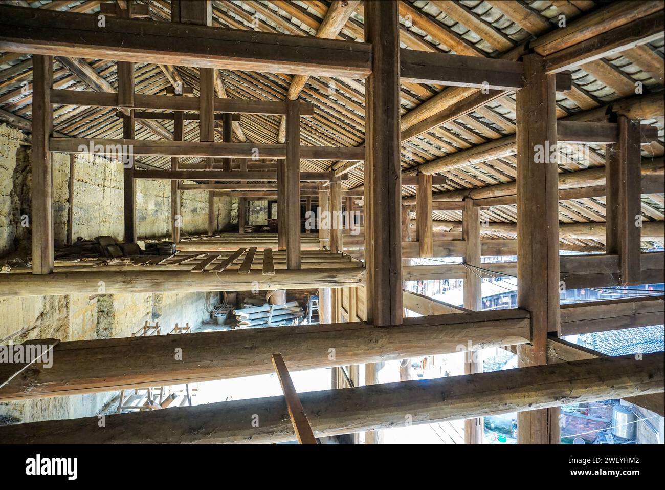 timber roof construction of Shunyu Lou, one of the largest tulou ...