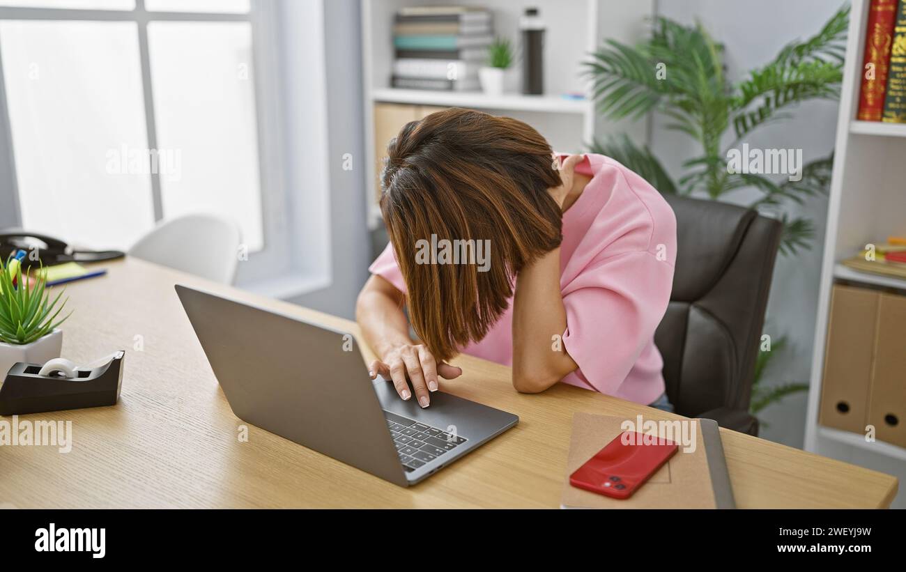 Stressed young hispanic businesswoman in office painfully grapples with ...