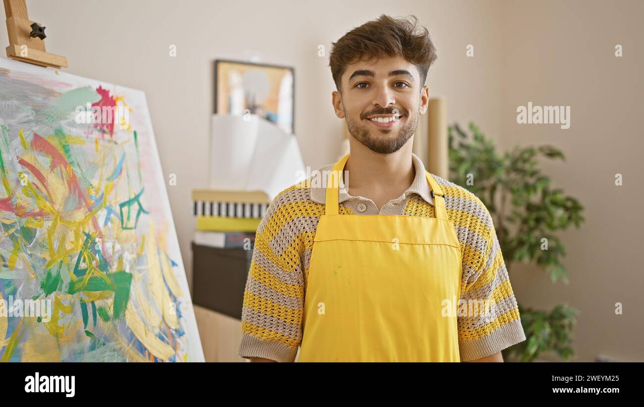Handsome young arab man, a confident artist with a warming smile ...