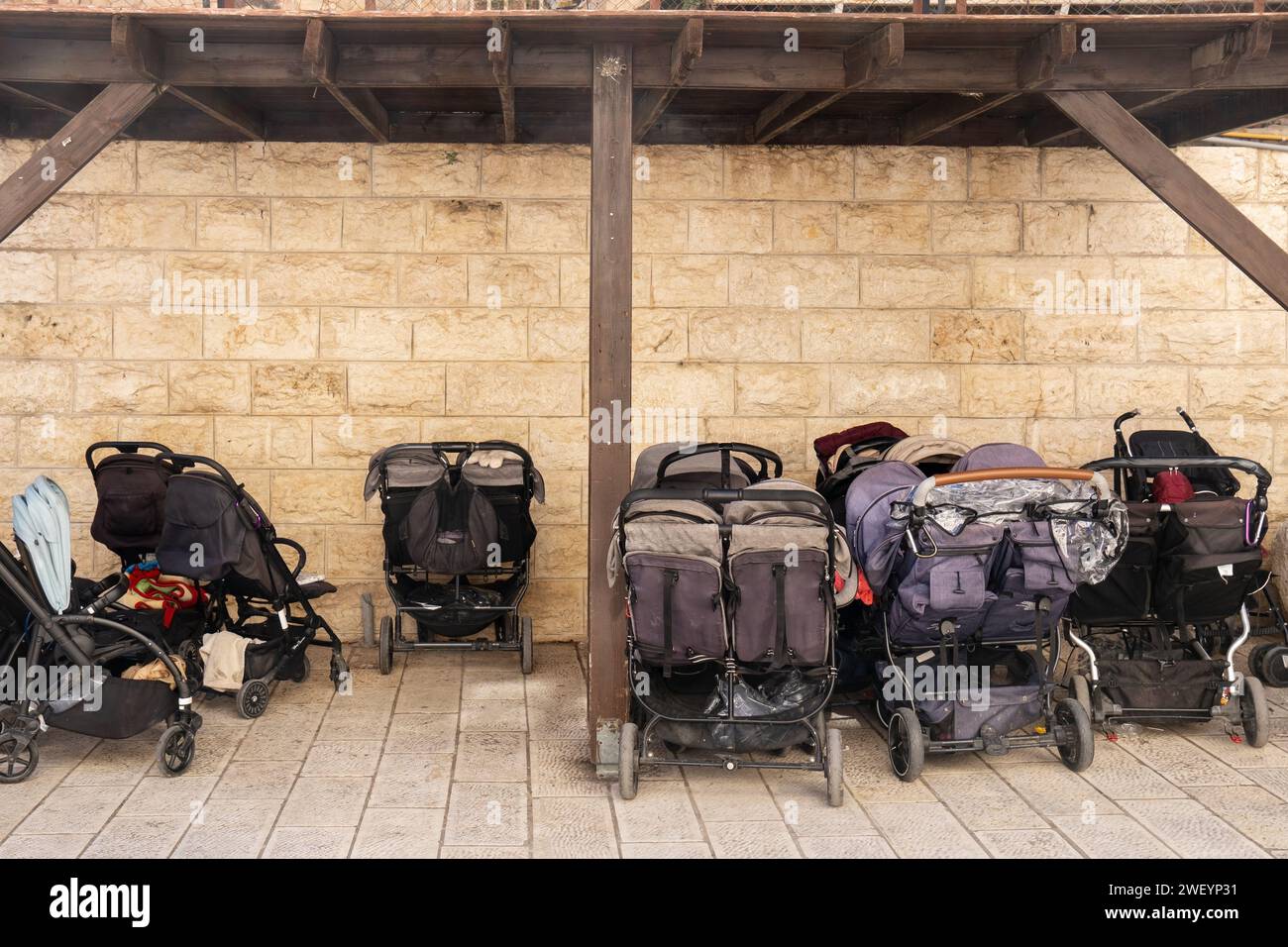 Parking area for baby strollers under a canopy Stock Photo - Alamy