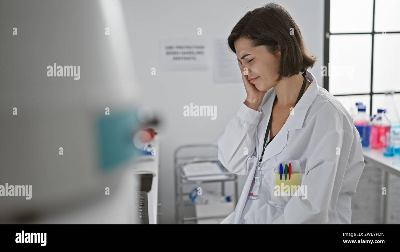 Stressed young hispanic woman scientist, beautiful despite overwork ...