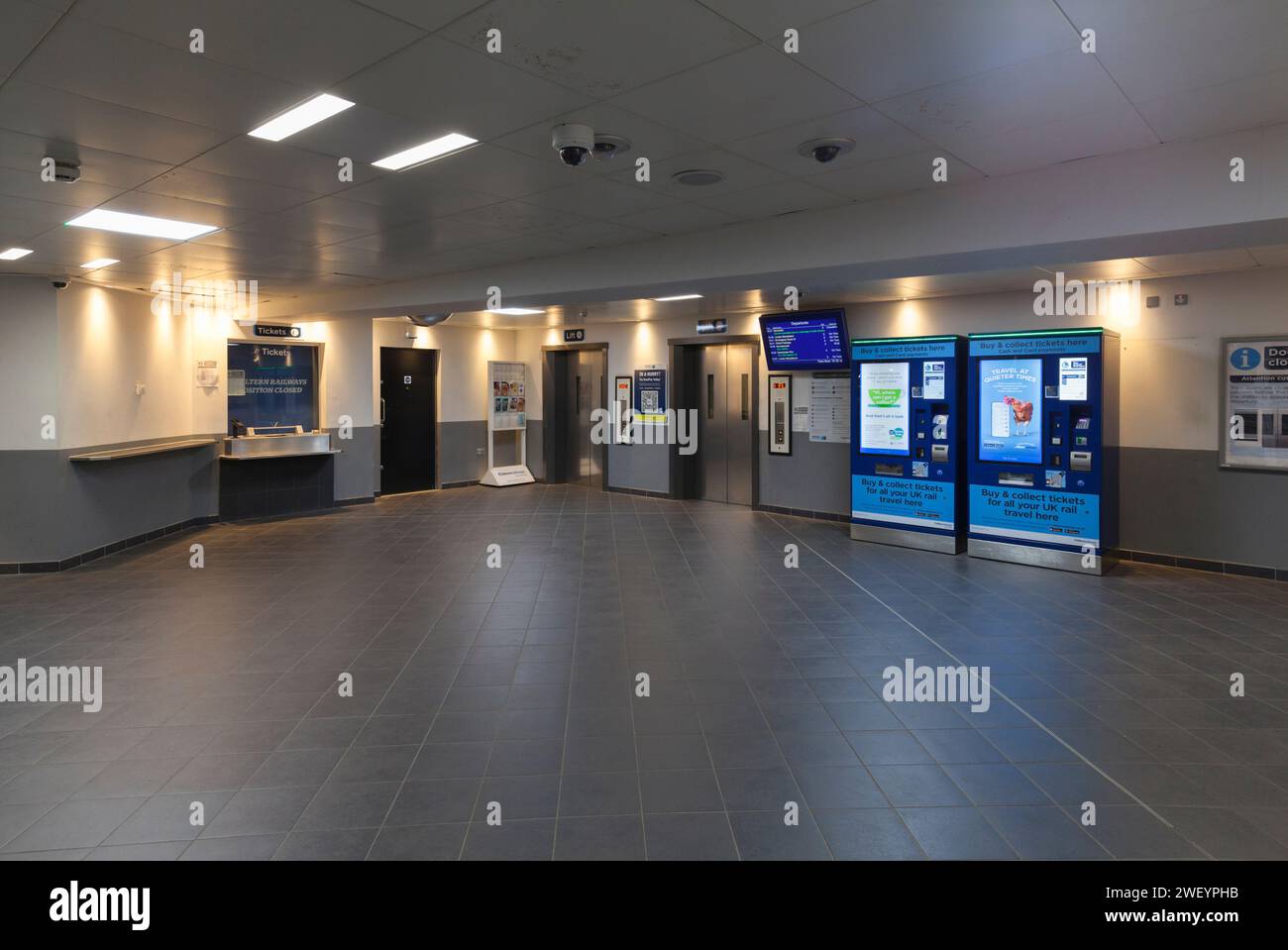 Banbury railway station ticket office with closed shutters and ticket ...