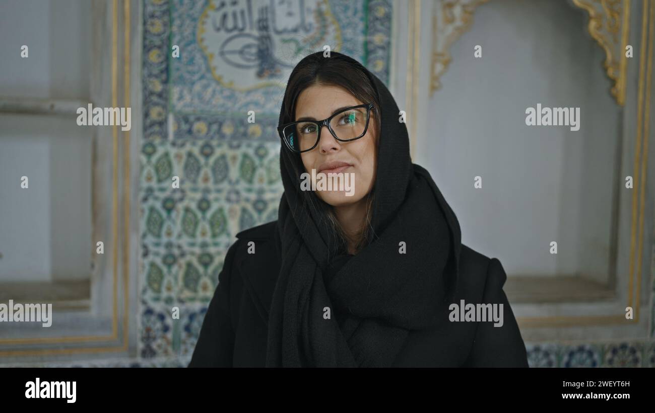 Contemplative woman wearing hijab glasses hi-res stock photography and images - Alamy