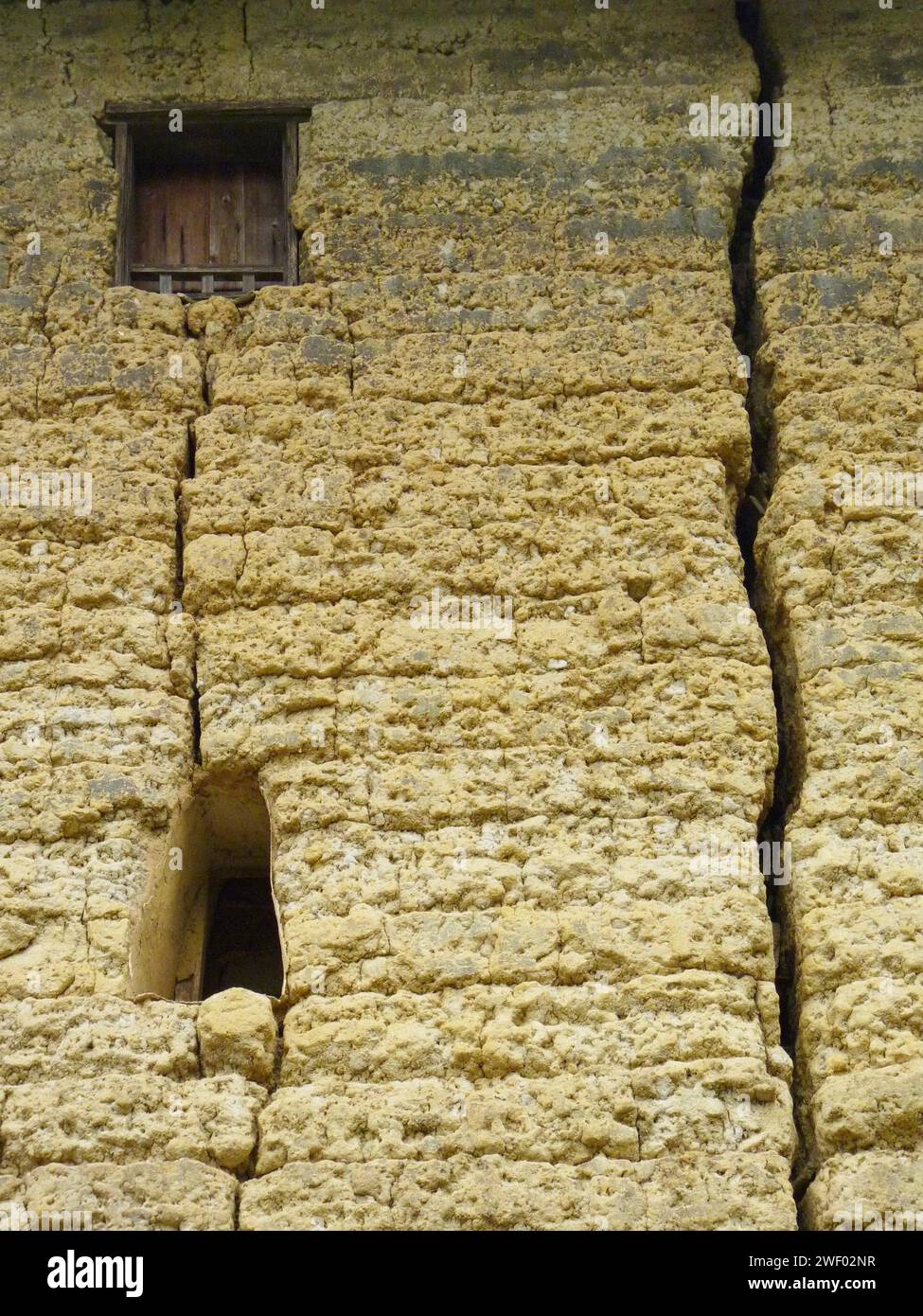 Vernacular Hakka tulou in Fujian, China: Wall of rammed earth marked by ...