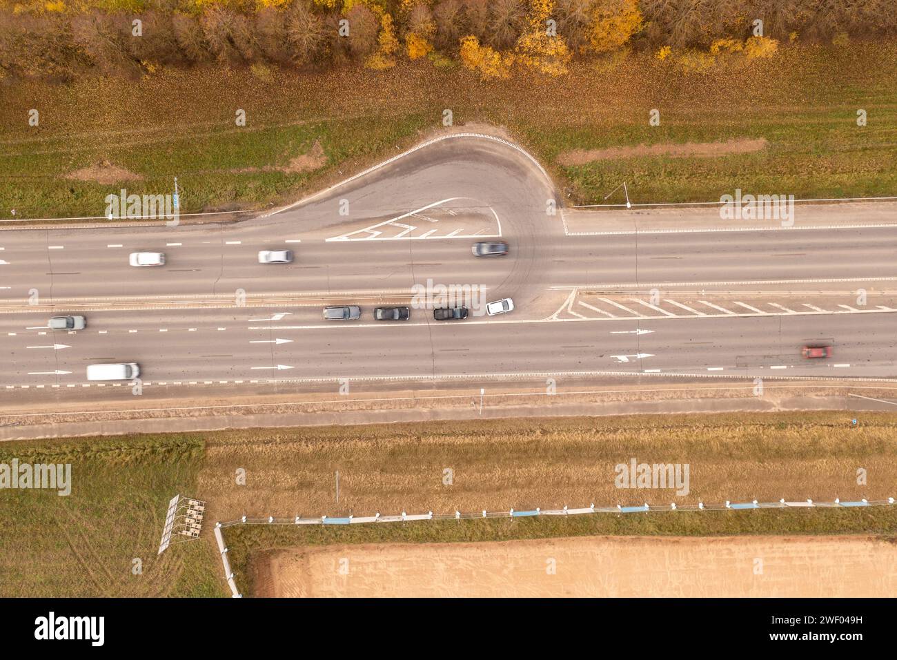 Drone photography of an U turn in a highway and cars turning during ...
