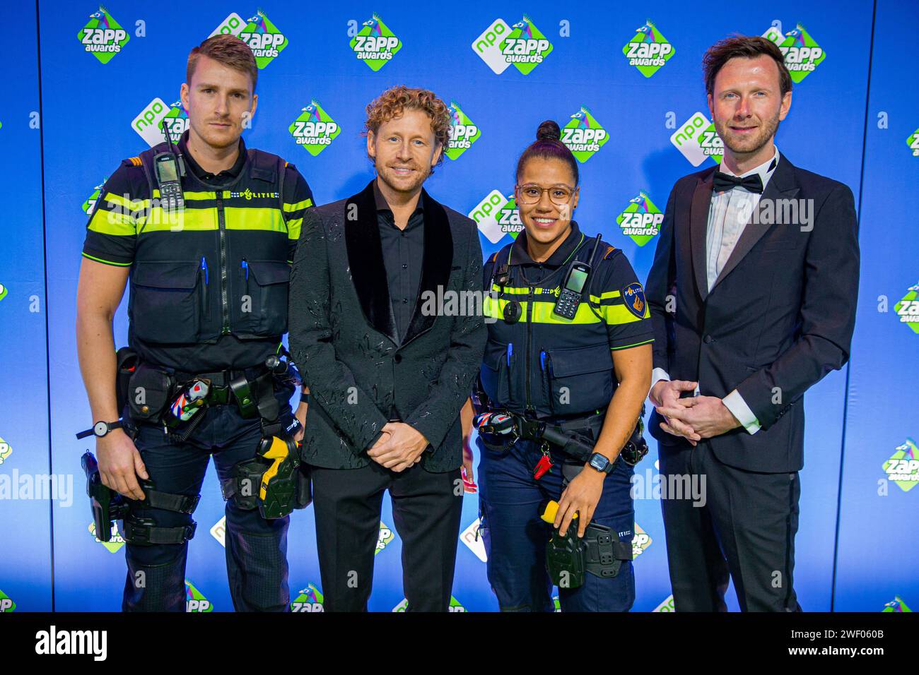 HILVERSUM - Ewout Genemans with police officers Brian and Keashia on the red carpet prior to the ...
