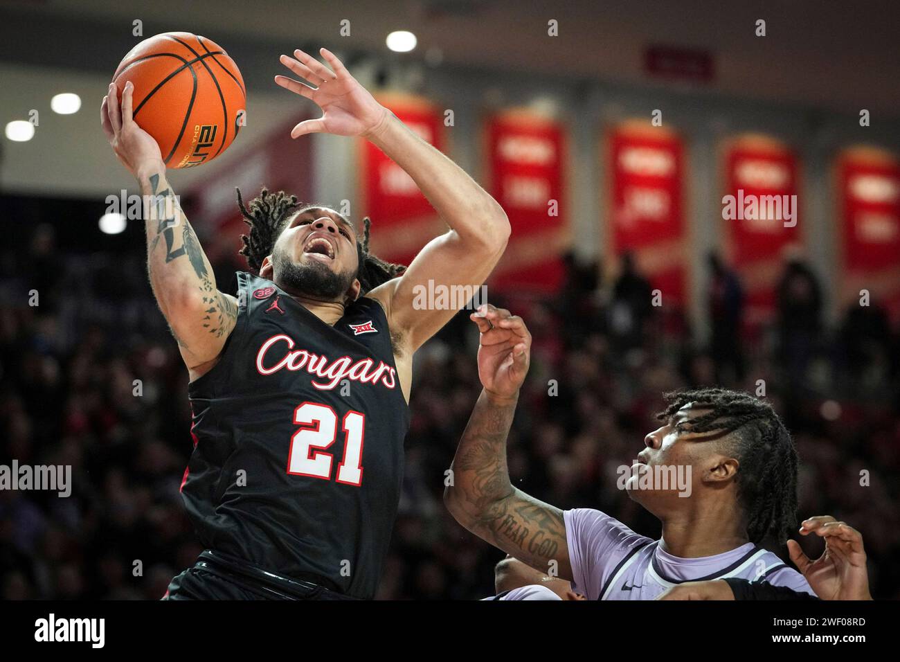 Houston guard Emanuel Sharp (21) shoots over Kansas State forward ...