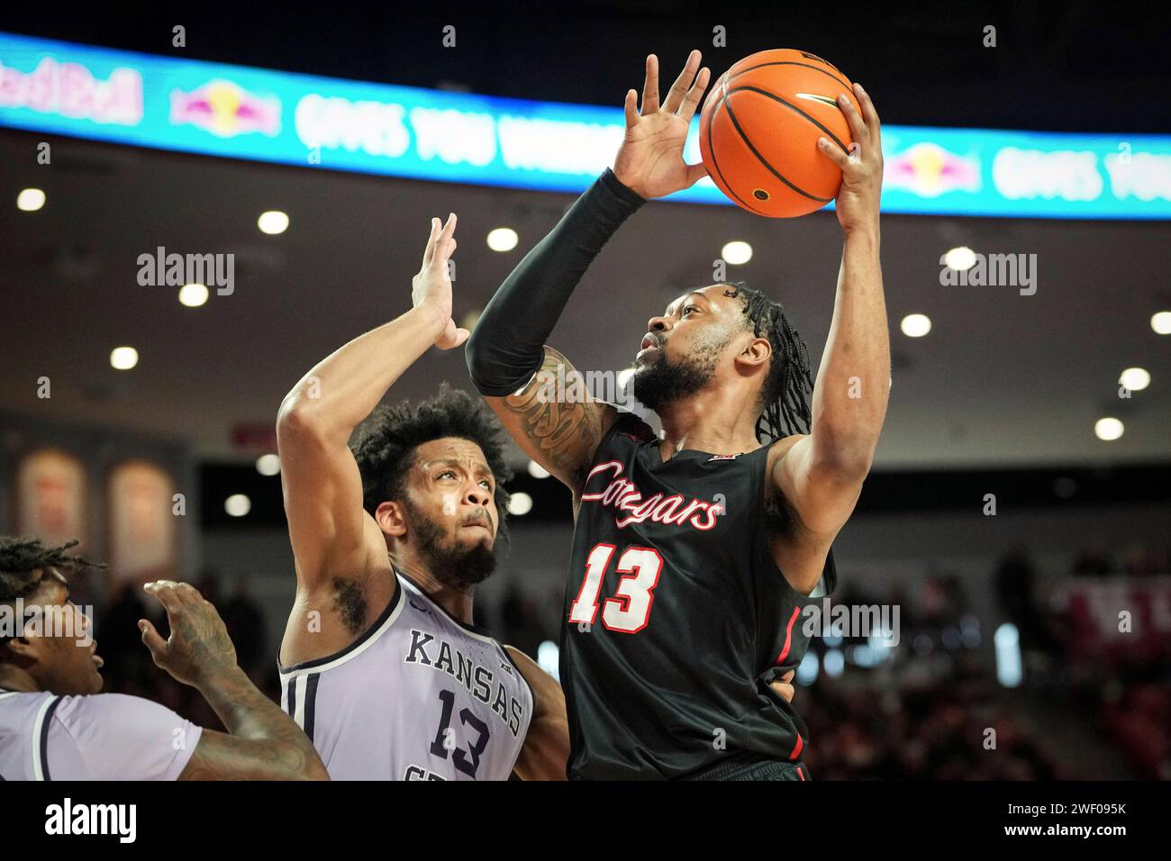 Houston forward J'Wan Roberts (13) drives to the basket as Kansas State ...
