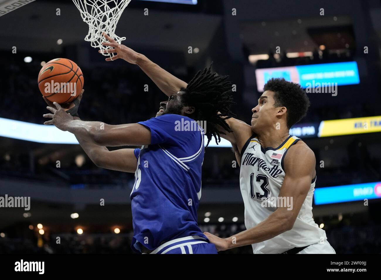 Seton Hall's Jaden Bediako tries to shoot past Marquette's Oso Ighodaro ...