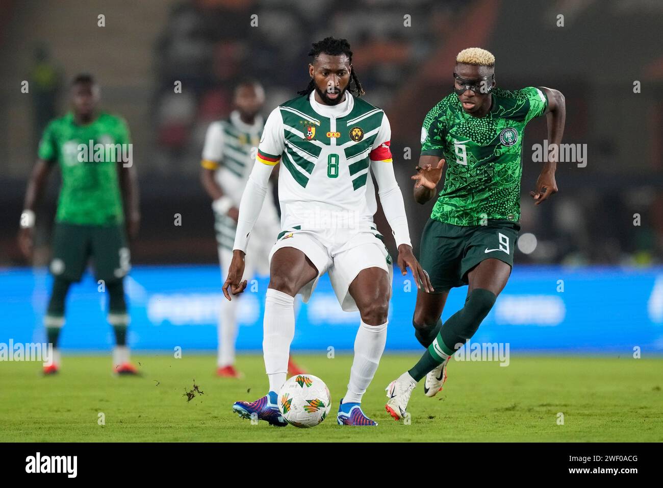 Nigeria's Victor Osimhen, right, challenges Cameroon's Andre-Frank ...