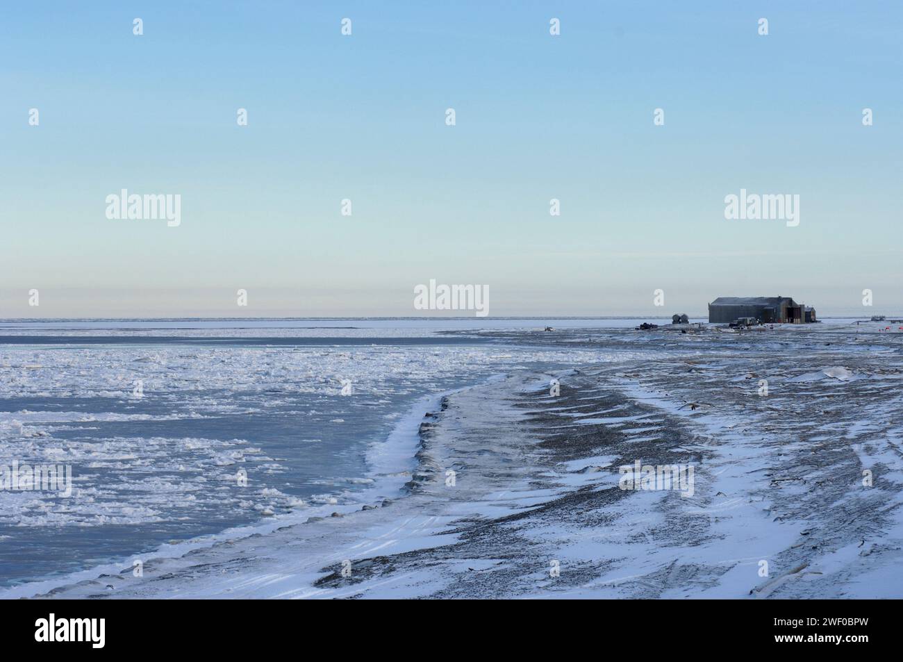 fall freeze up of the Arctic ocean with an old airforce hanger, off the ...