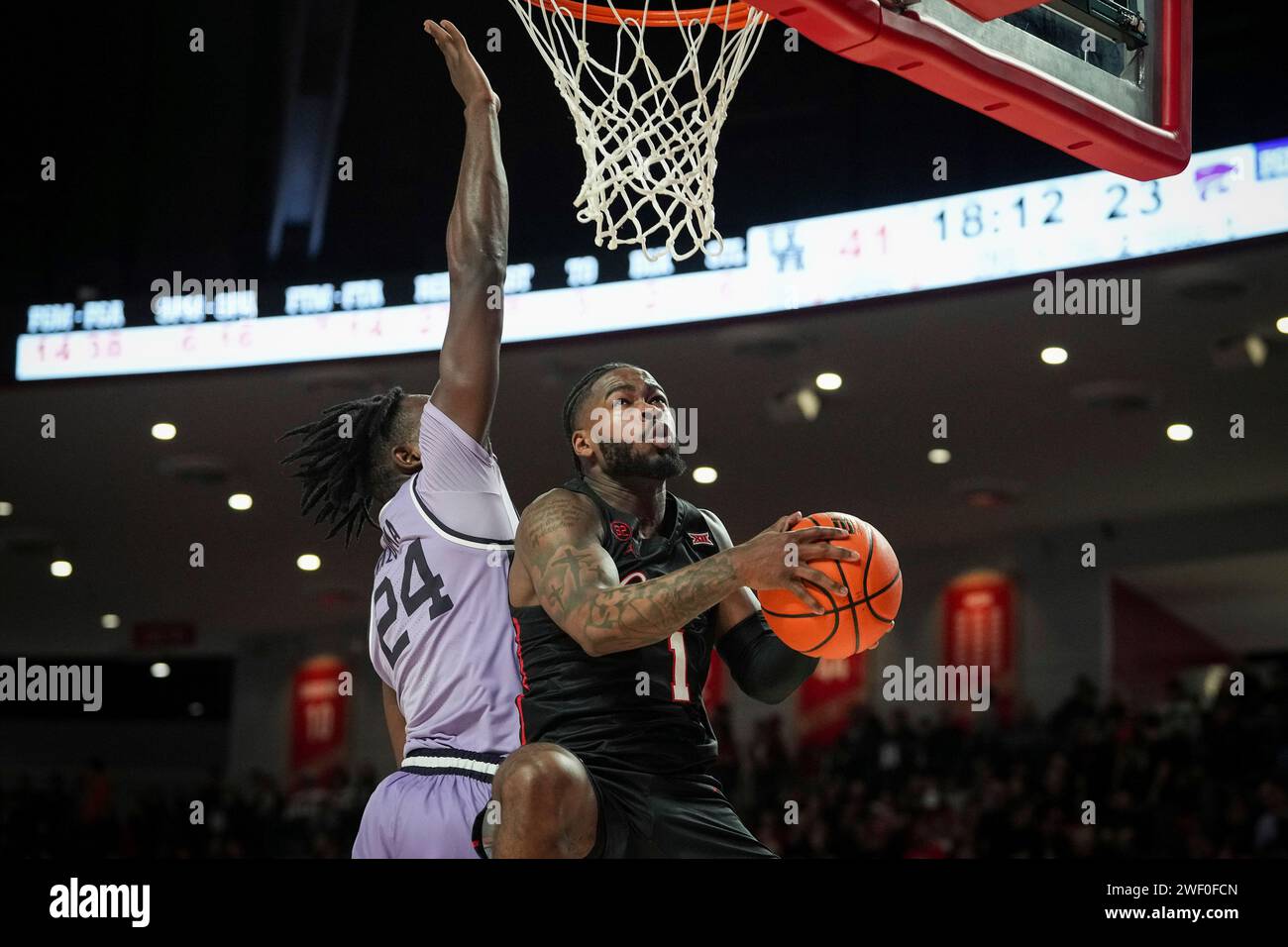 Houston guard Jamal Shead (1) drives to the basket past Kansas State ...