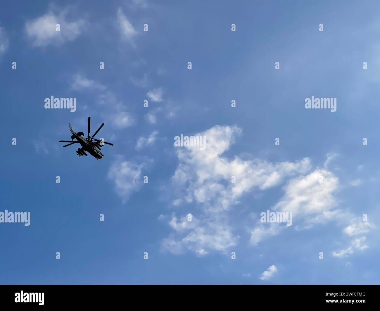Russian military helicopter alligator in the clear blue sky Stock Photo ...