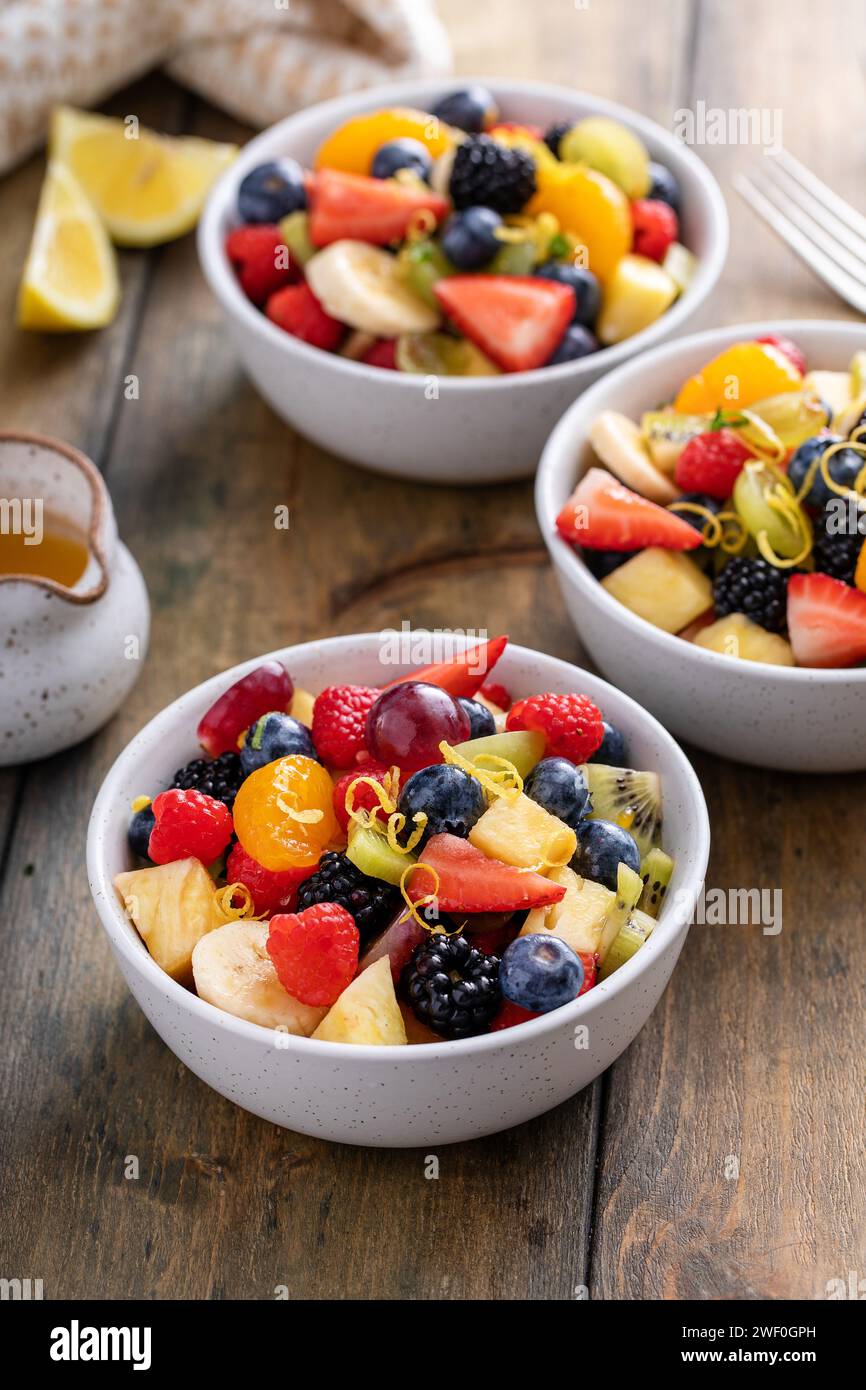 Healthy and colorful fruit salad with banana, pineapples, berries ...