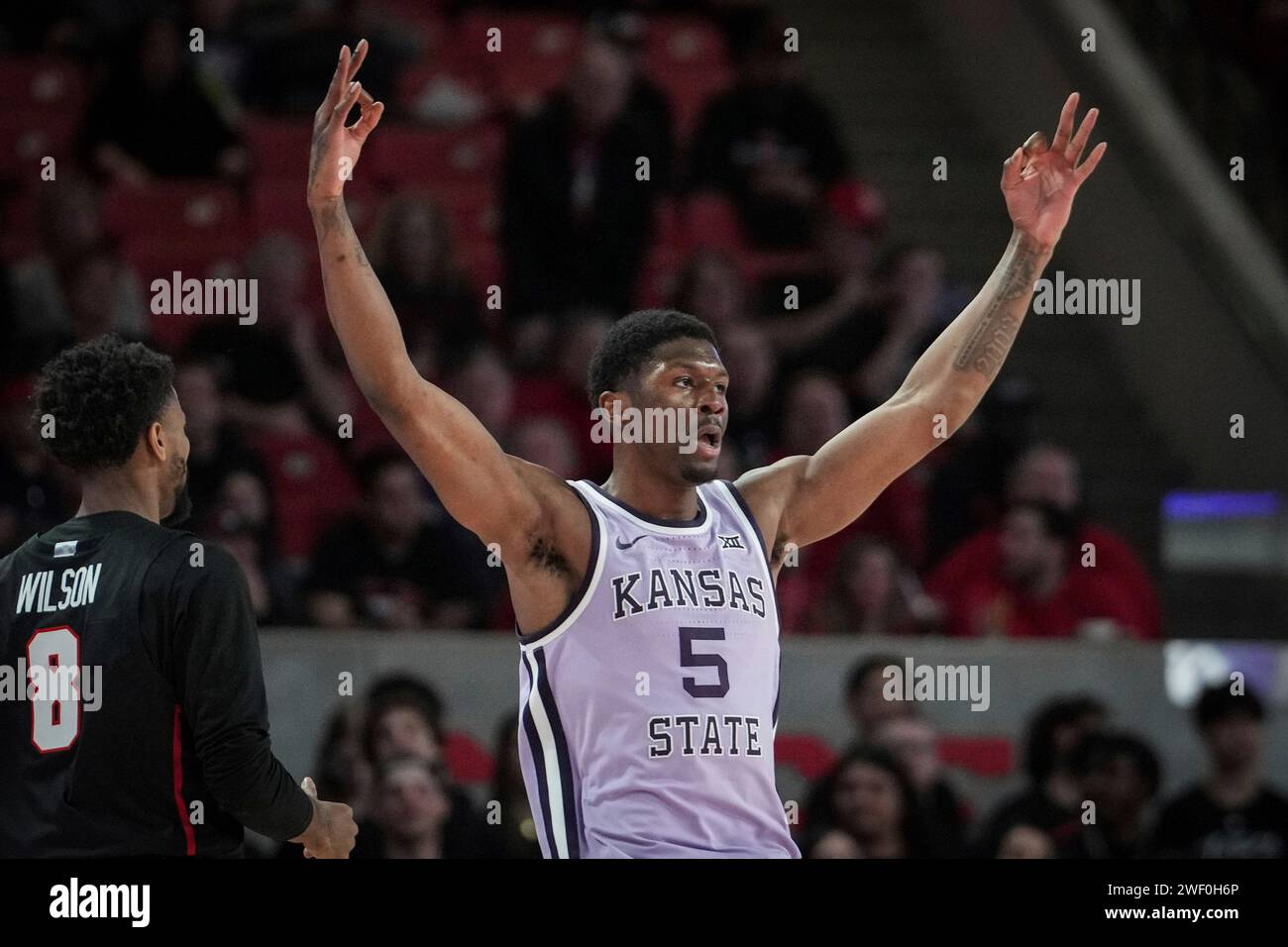 Kansas State guard Cam Carter (5) celebrates during the first half of ...