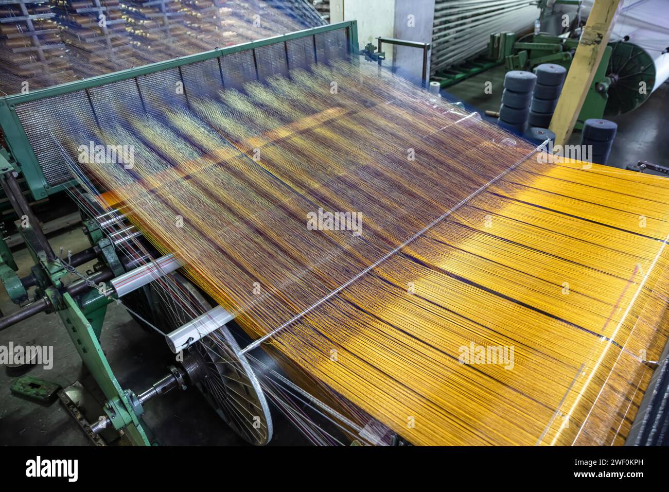 Modern Carpet weaving factory. Carpet making machine needle. Yarn ...