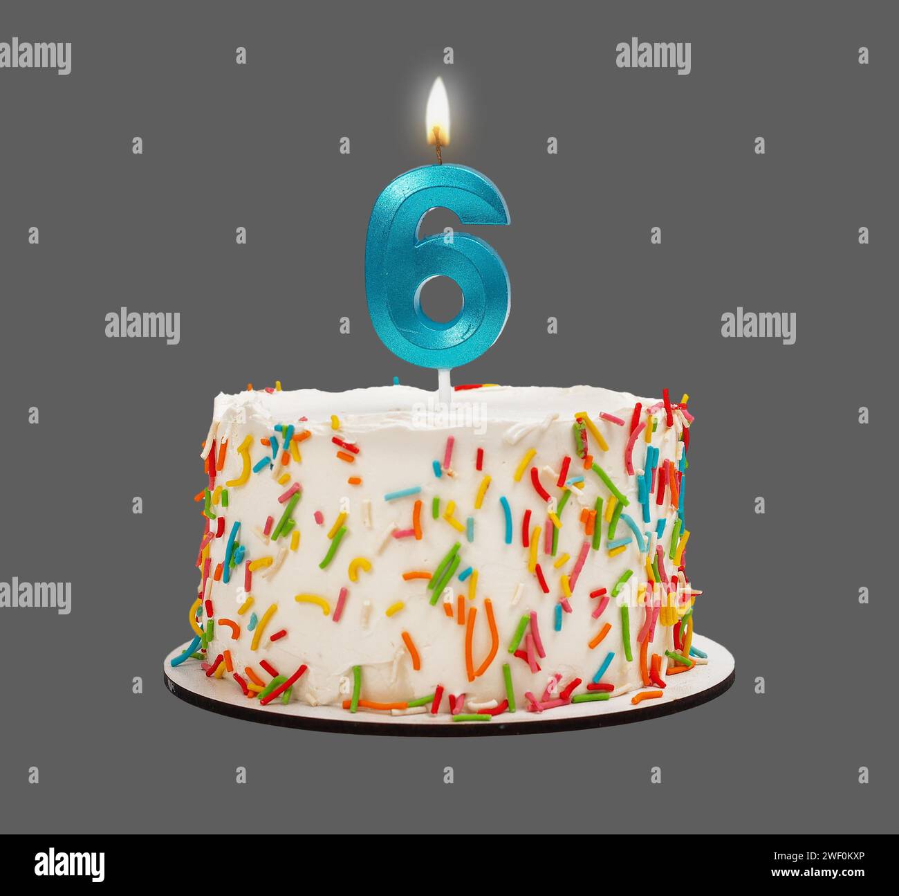 6 shaped candle light on happy birthday cake isolated on white ...