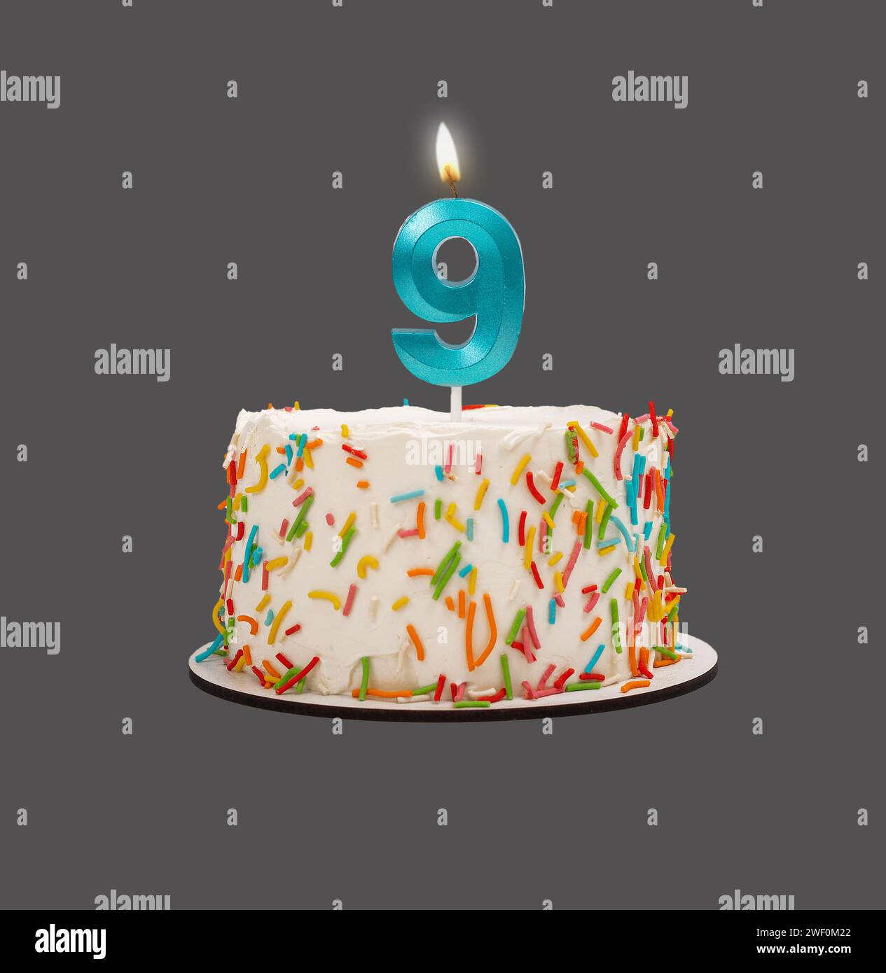 9 shaped candle light on happy birthday cake isolated on white ...