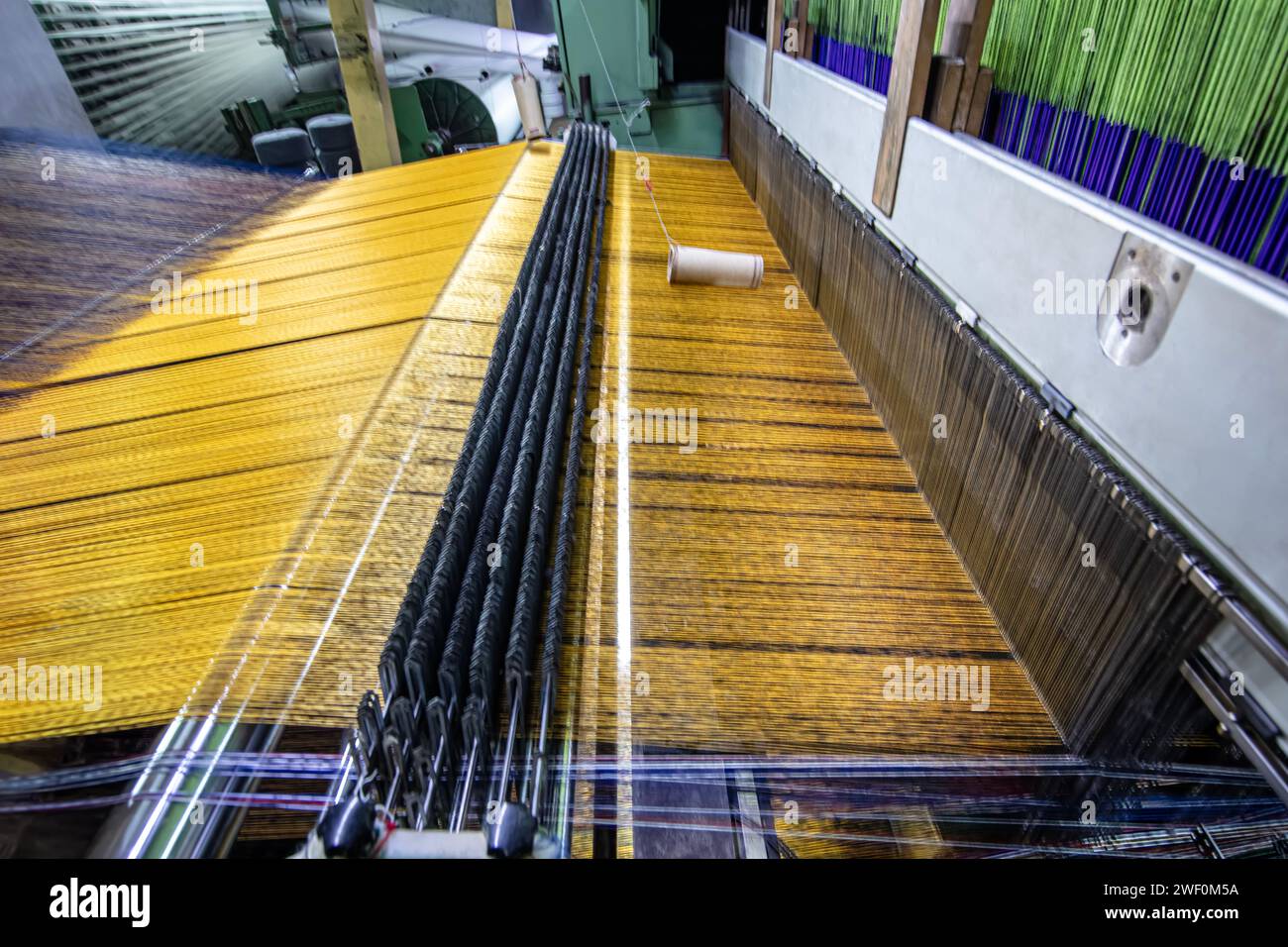 Modern Carpet weaving factory. Carpet making machine needle. Yarn ...