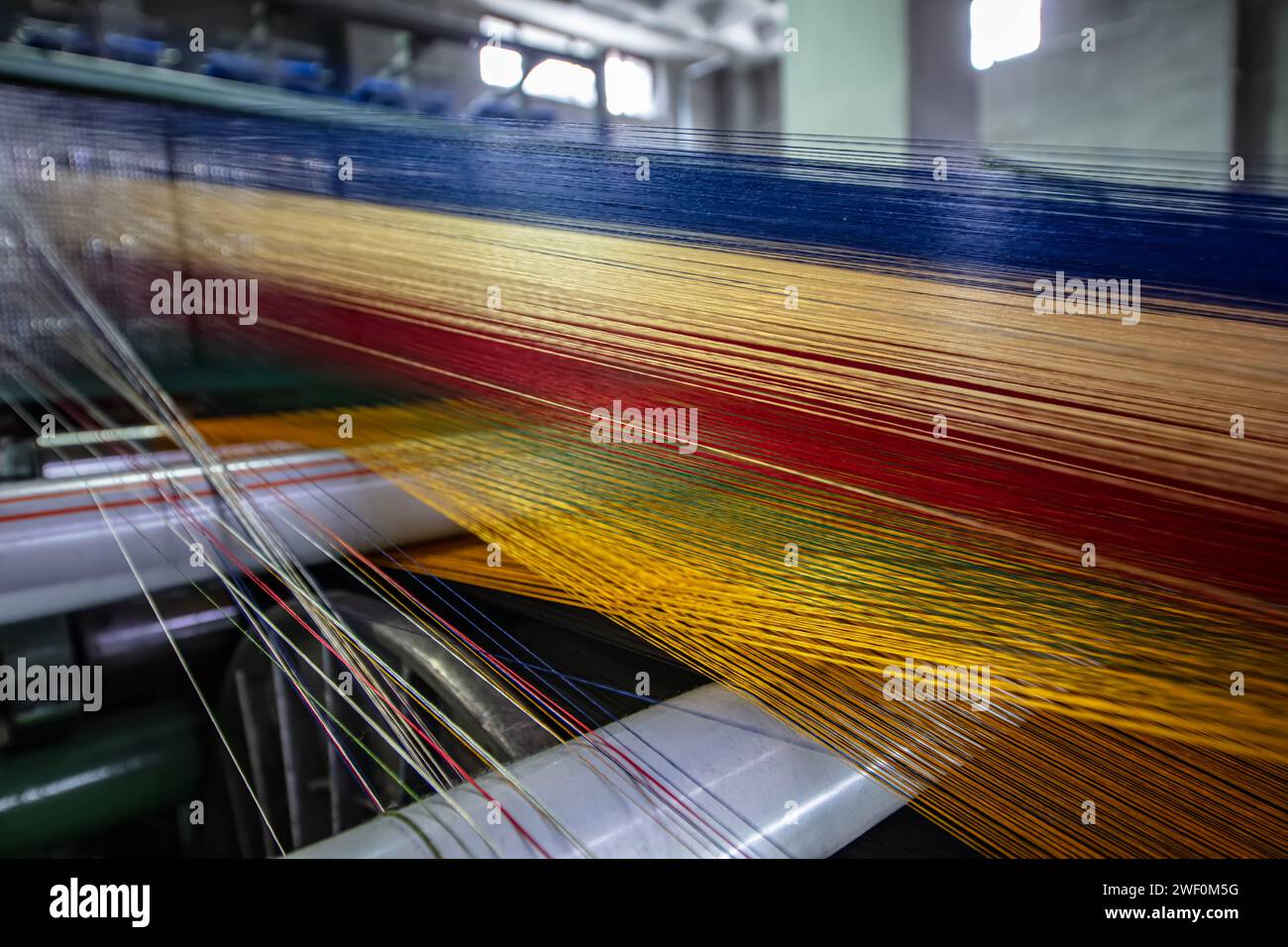 Modern Carpet weaving factory. Carpet making machine needle. Yarn ...