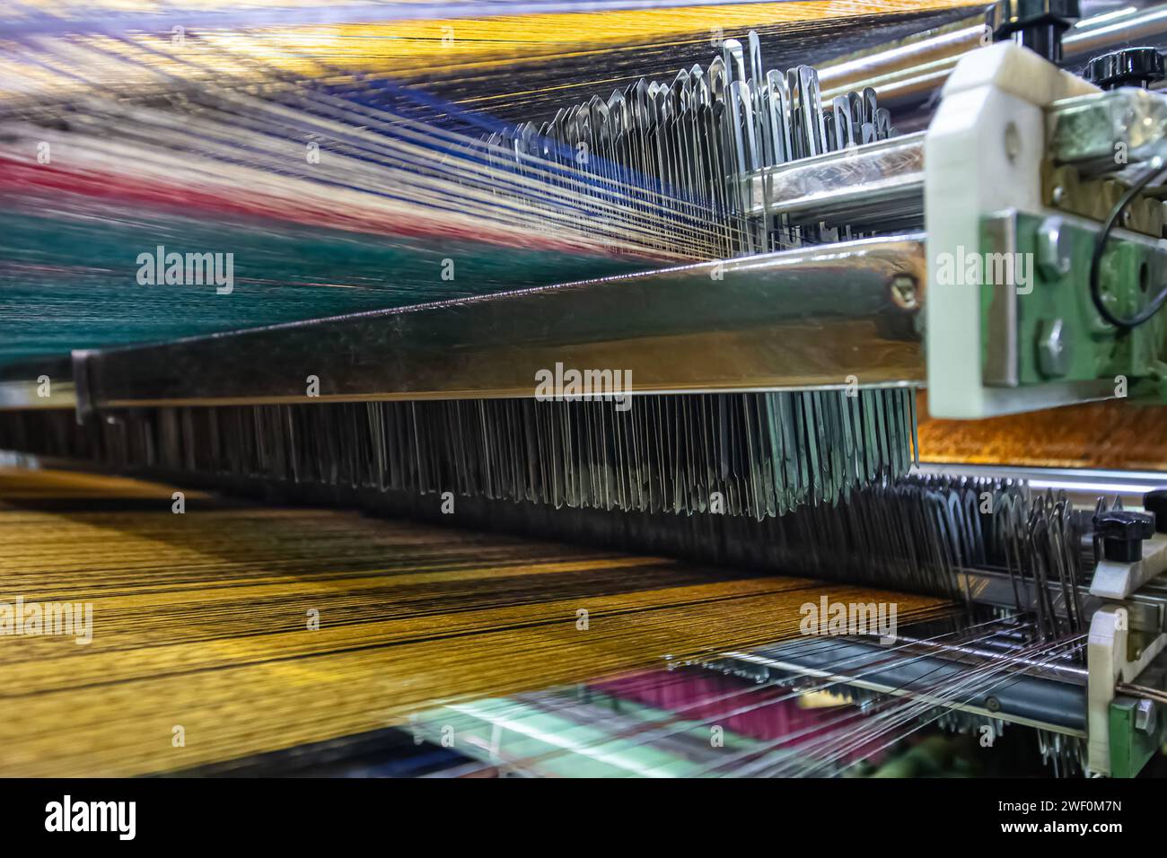 Modern Carpet weaving factory. Carpet making machine needle. Yarn ...