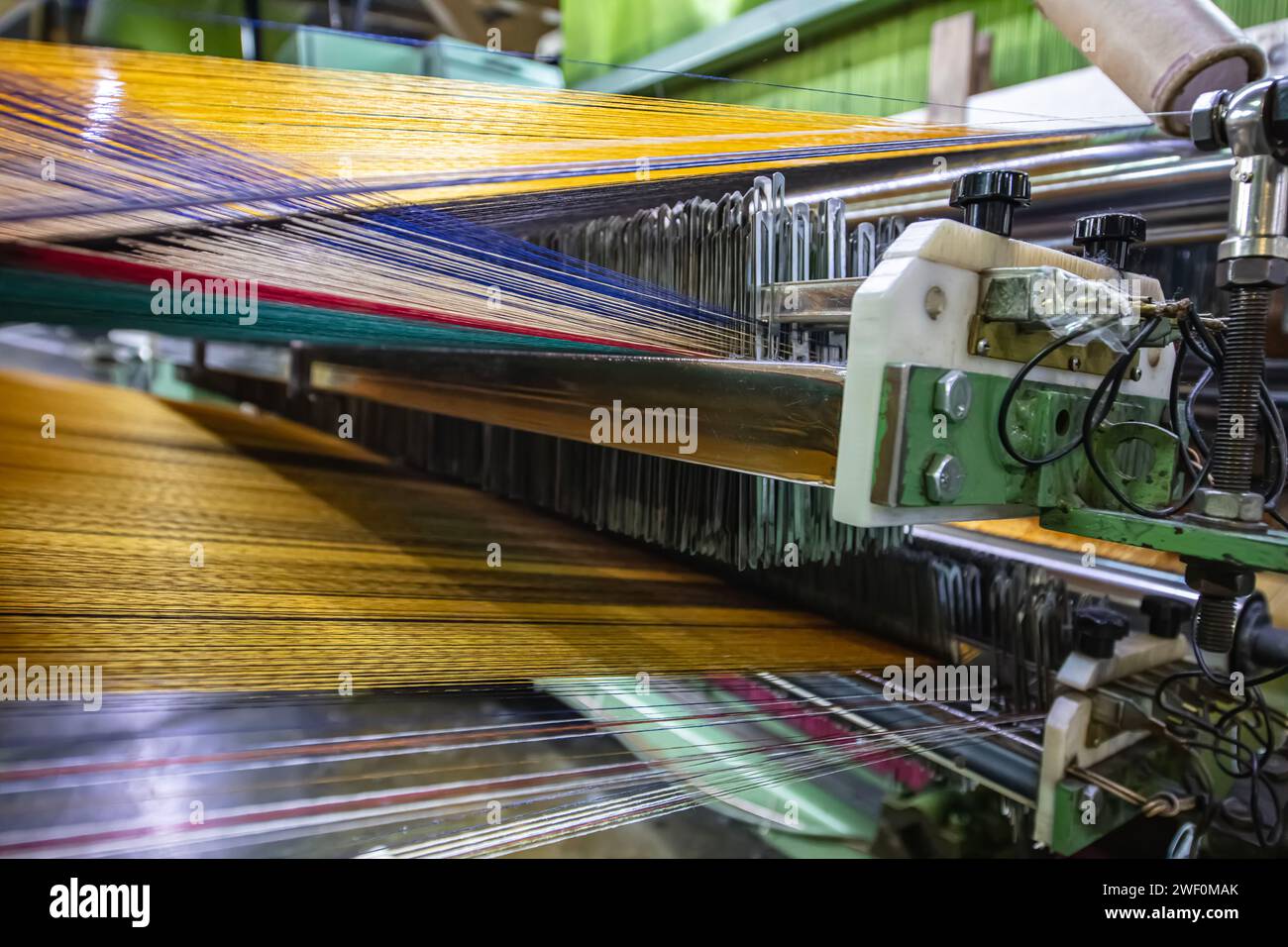 Modern Carpet weaving factory. Carpet making machine needle. Yarn ...