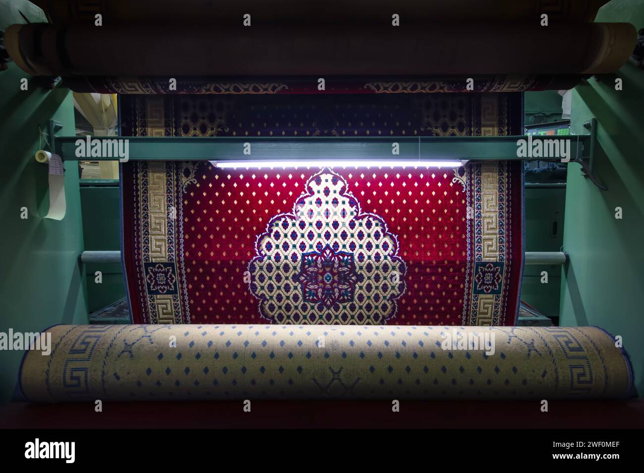 Modern Carpet weaving factory. Carpet making machine needle. Yarn ...