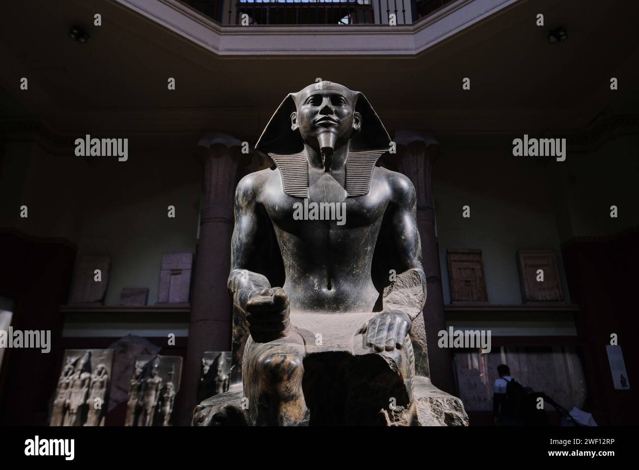 Cairo, Egypt - January 2, 2024: Statue of pharaoh khafre enthroned in the egyptian museum in ...