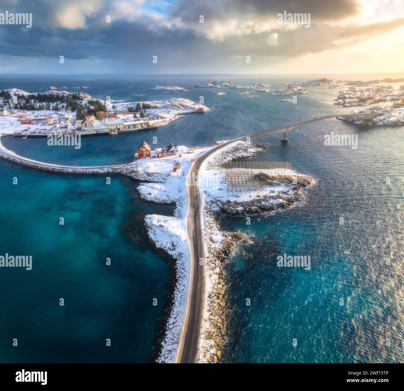 Aerial view of road, bridges, snowy islands, rorbu, sea at sunset Stock ...