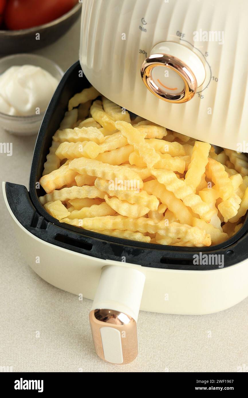 Wavy Potato Stick French Fries are about to be Fried in an Oil Free Air ...