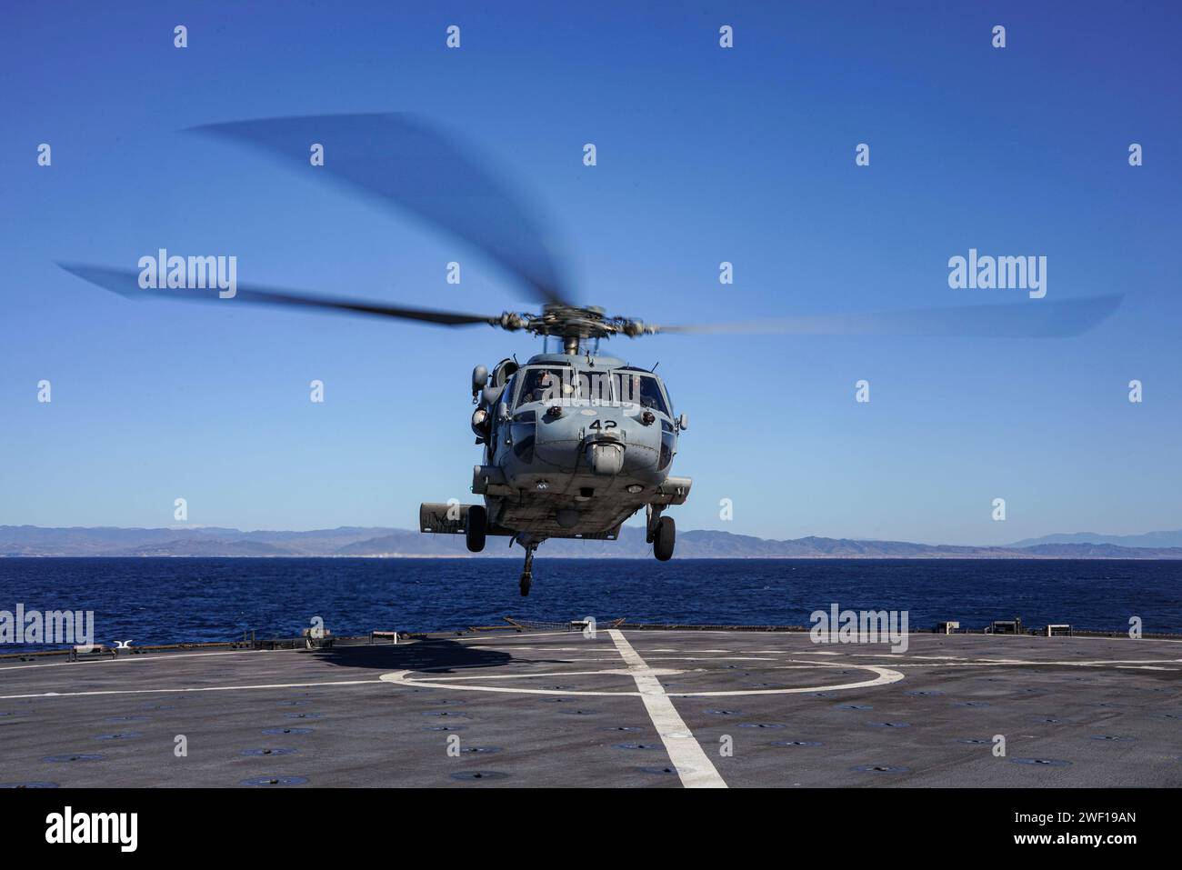 An SH-60S Seahawk, attached to Helicopter Sea Combat Squadron (HSC) 23 ...