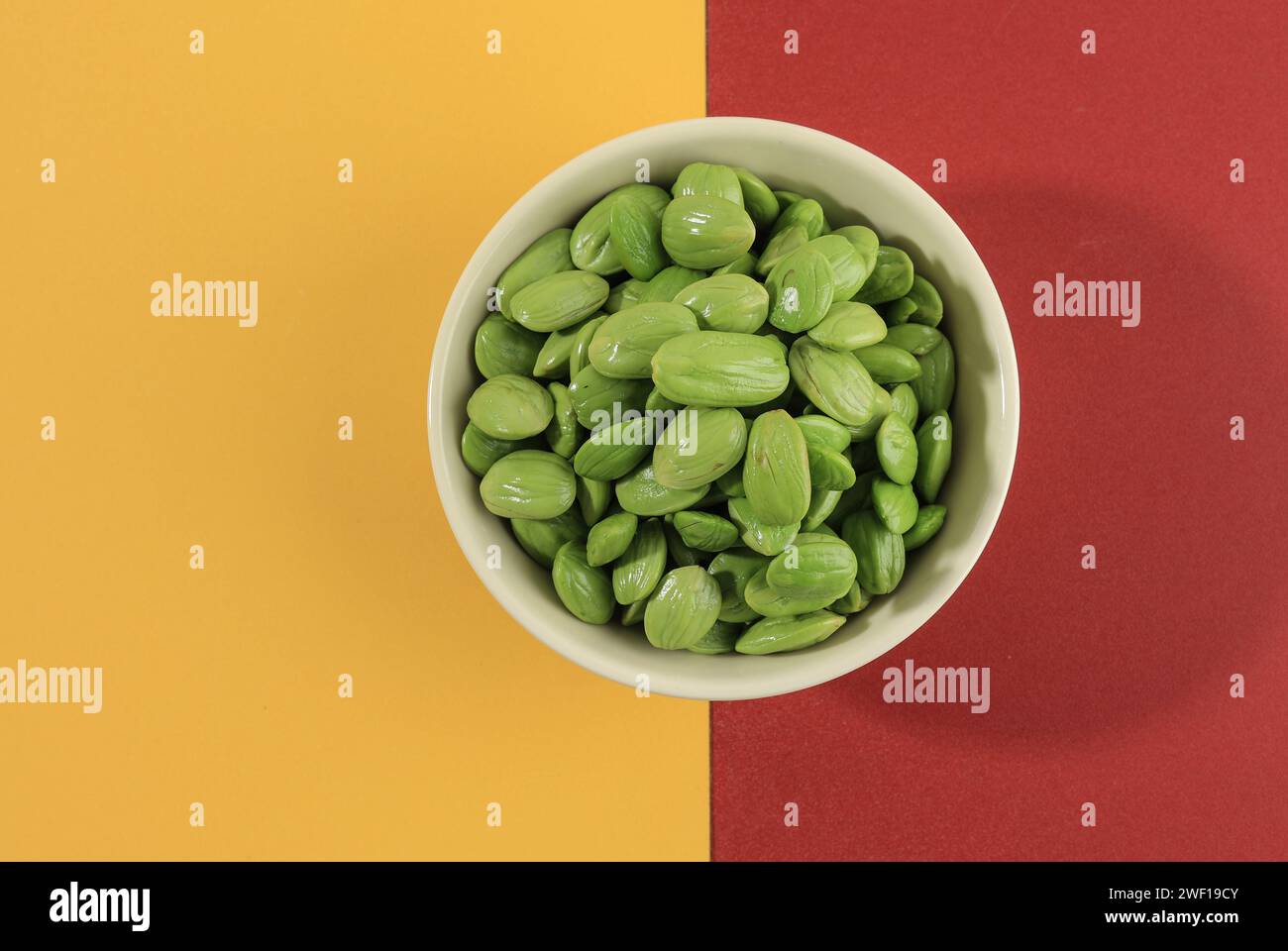Petai or Pete Stinky Bean on White Ceramic Bowl, Peeled from the Skin ...