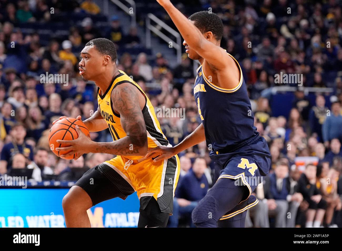 Iowa guard Tony Perkins (11) looks to pass as Michigan guard Nimari ...