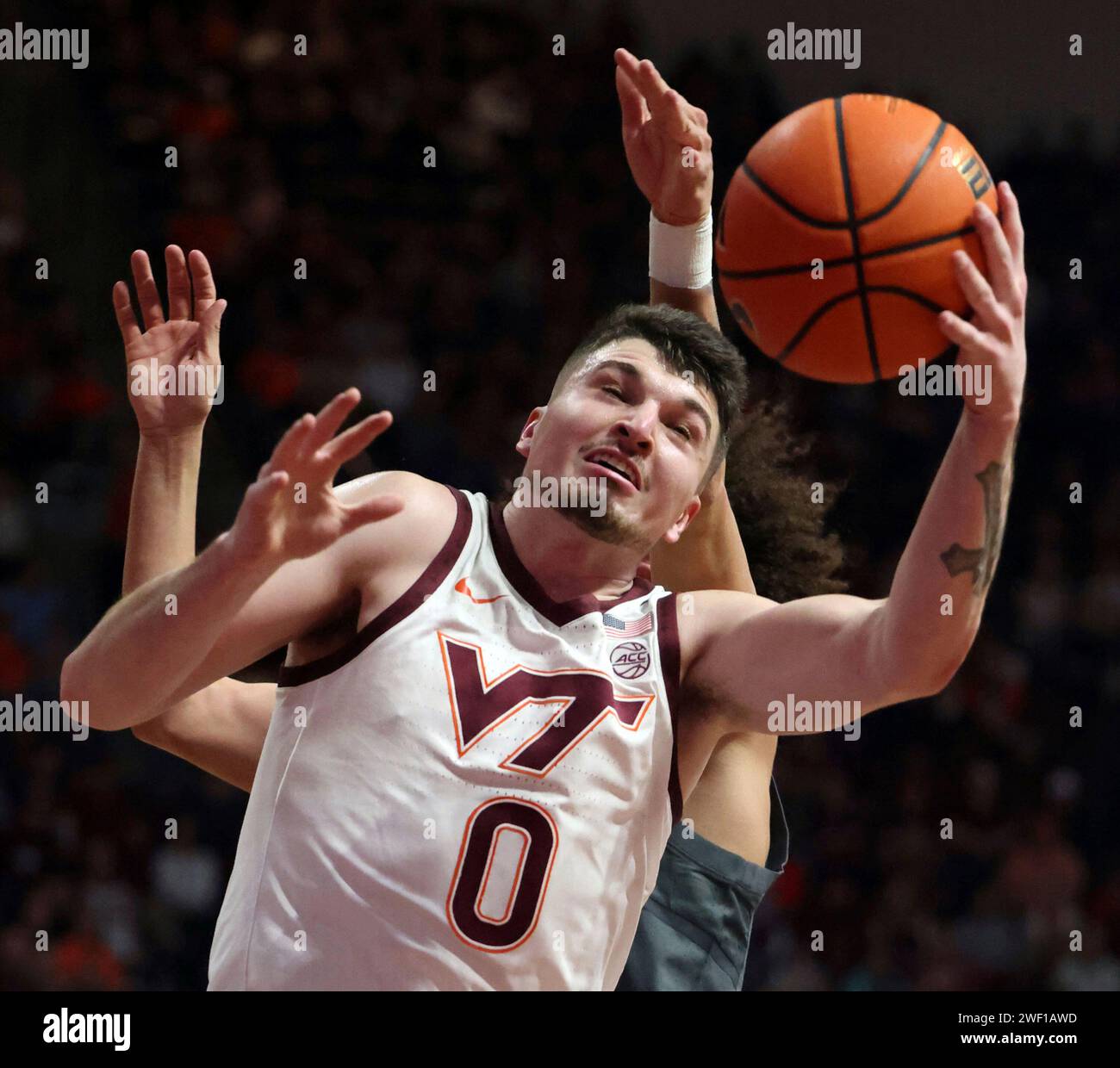 Virginia Tech's Hunter Cattoor (0) grabs a defensive rebound in the ...