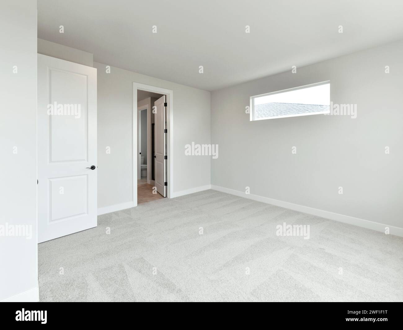 Modern residential empty bedroom interior Stock Photo - Alamy