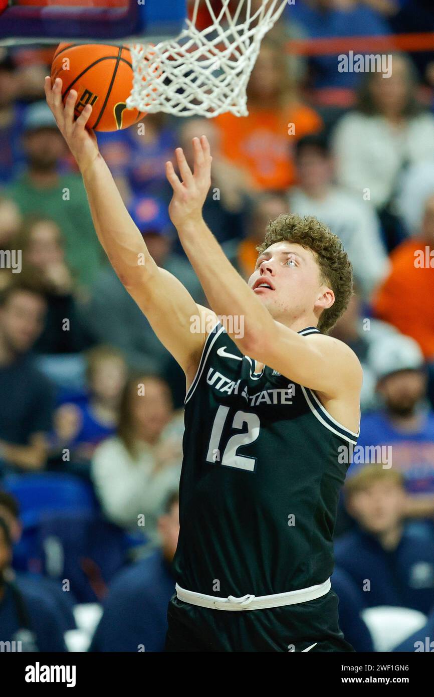 Utah State guard Mason Falslev (12) with a break away layup against ...
