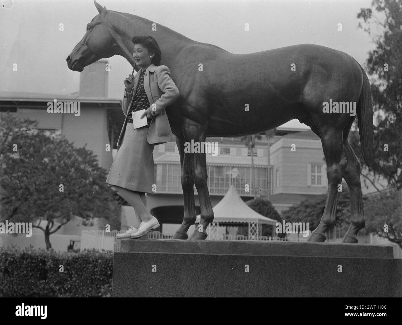 Arcadia, California. Mrs. Lily Okuru poses with statue of ''Seabiscuit ...