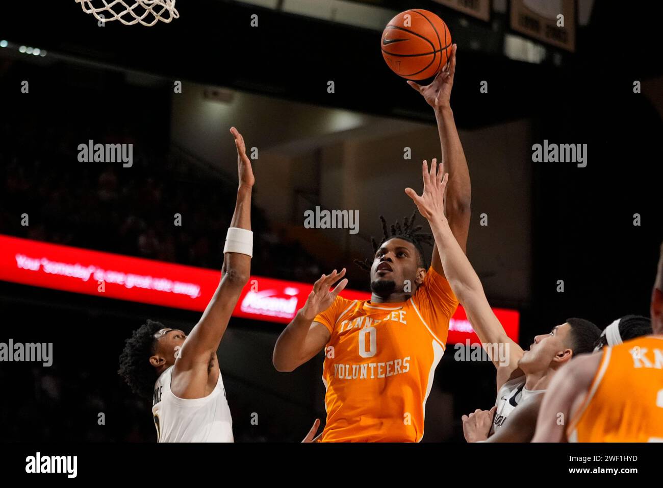 Tennessee forward Jonas Aidoo (0) shoots over Vanderbilt guard Tyrin ...