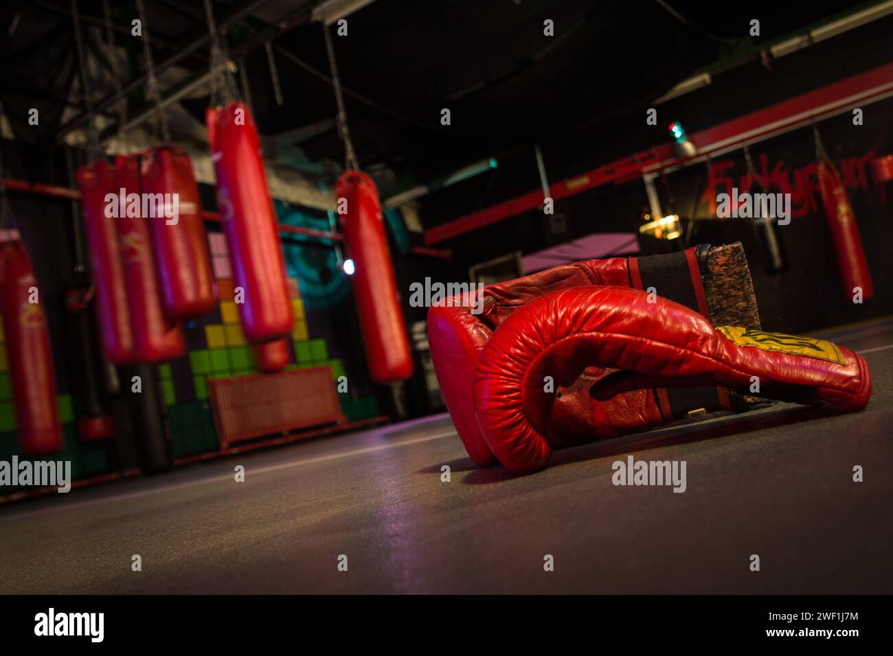 Red boxing gloves on floor hi-res stock photography and images - Alamy