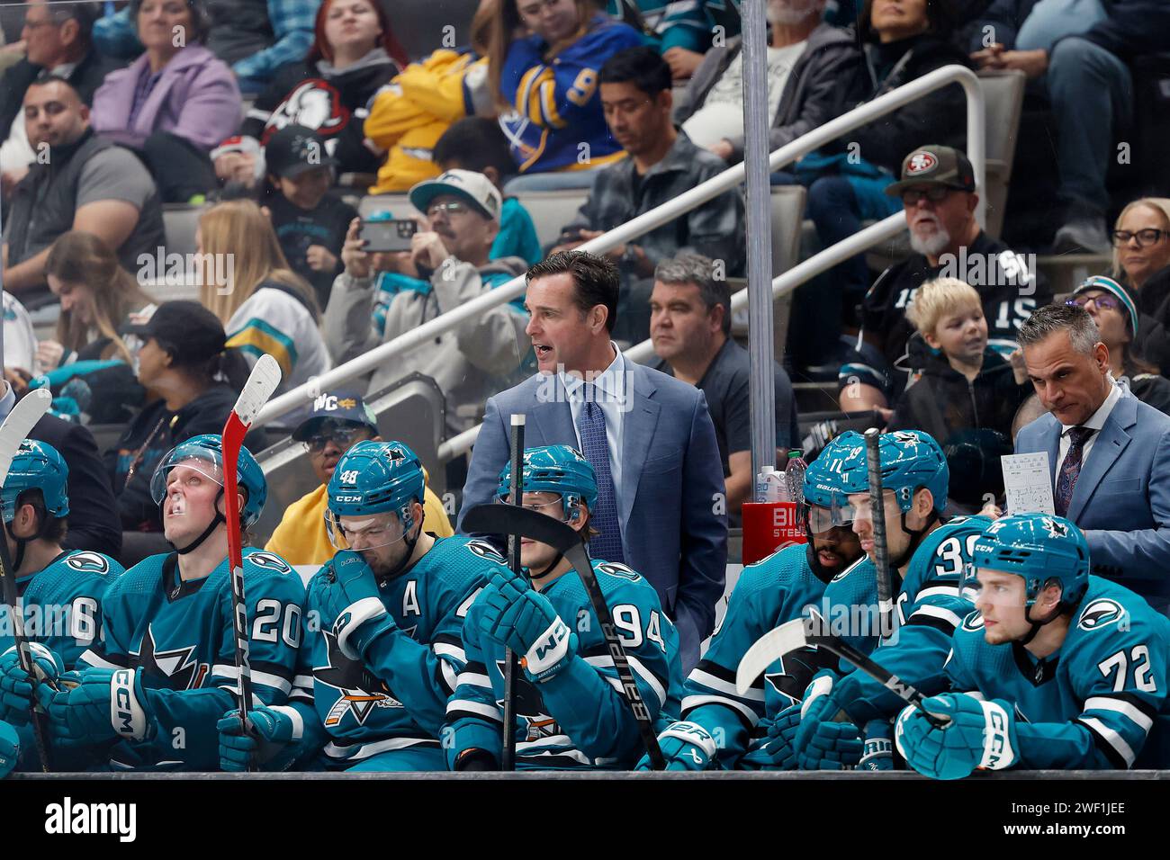 San Jose Sharks head coach David Quinn, center, reacts behind the bench ...