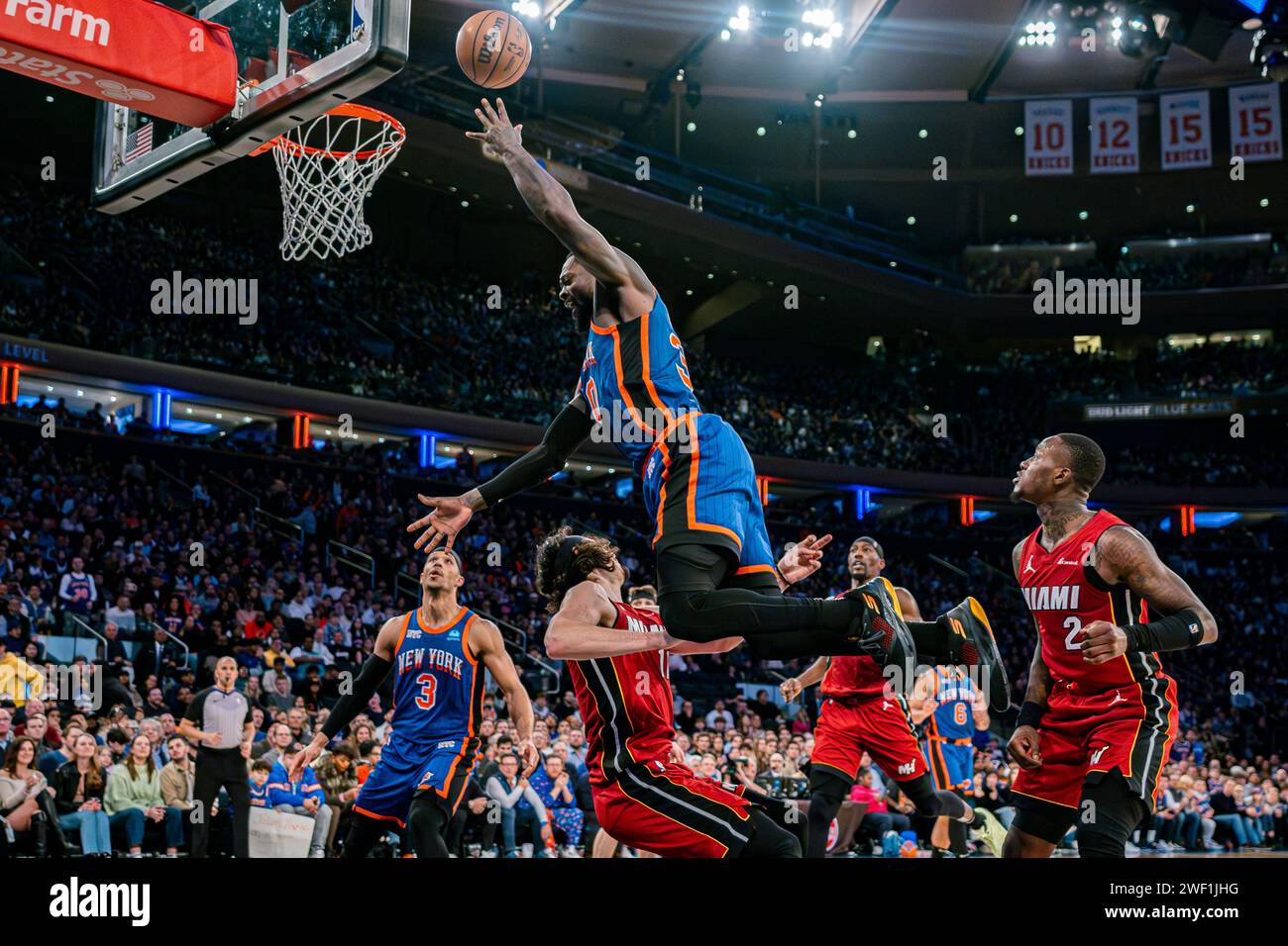 New York Knicks forward Julius Randle, top, is fouled by Miami Heat ...