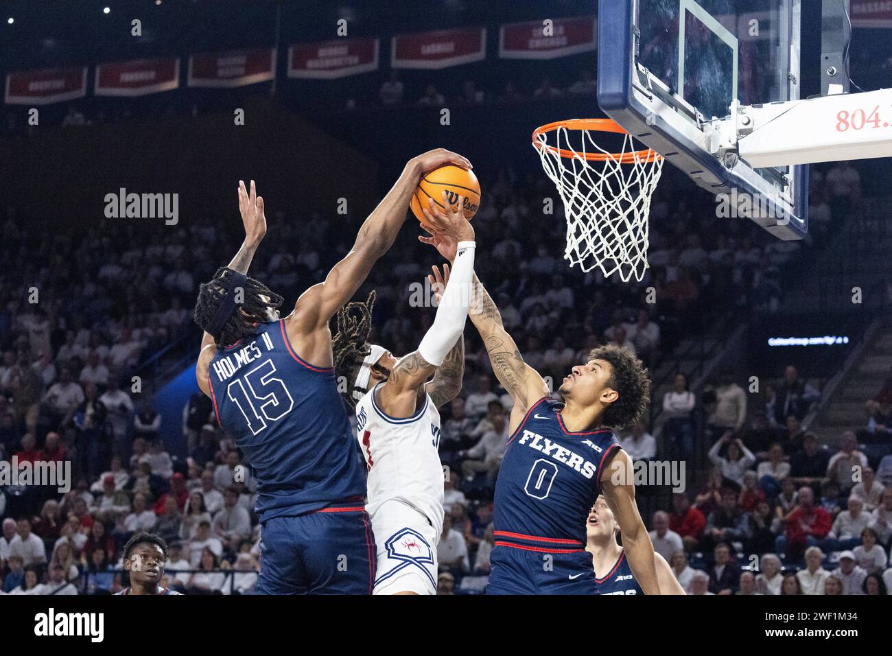 Richmond guard DeLonnie Hunt (3) has his shot blocked by Dayton forward ...